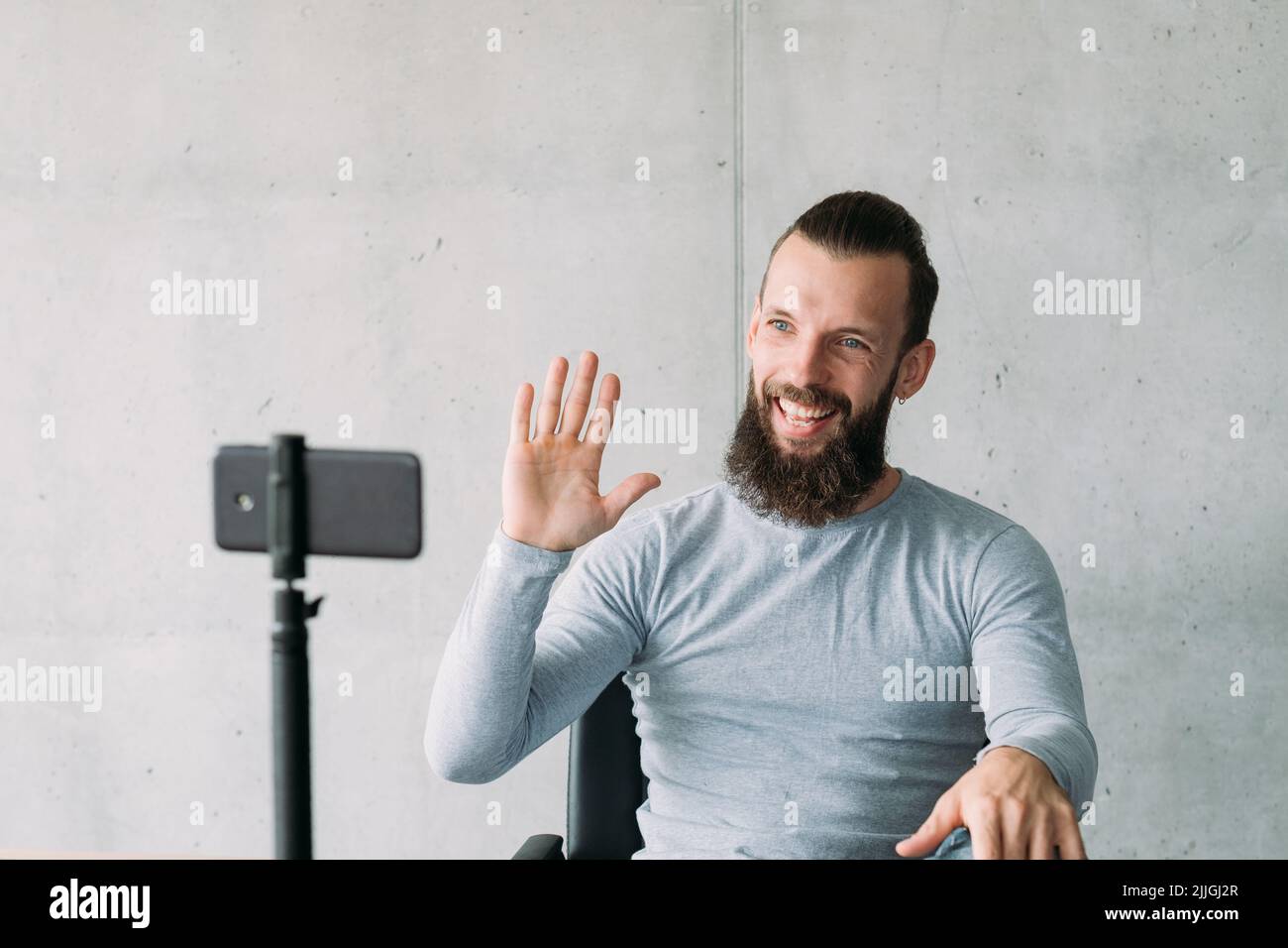 social vlog man smartphone greeting subscribers Stock Photo - Alamy