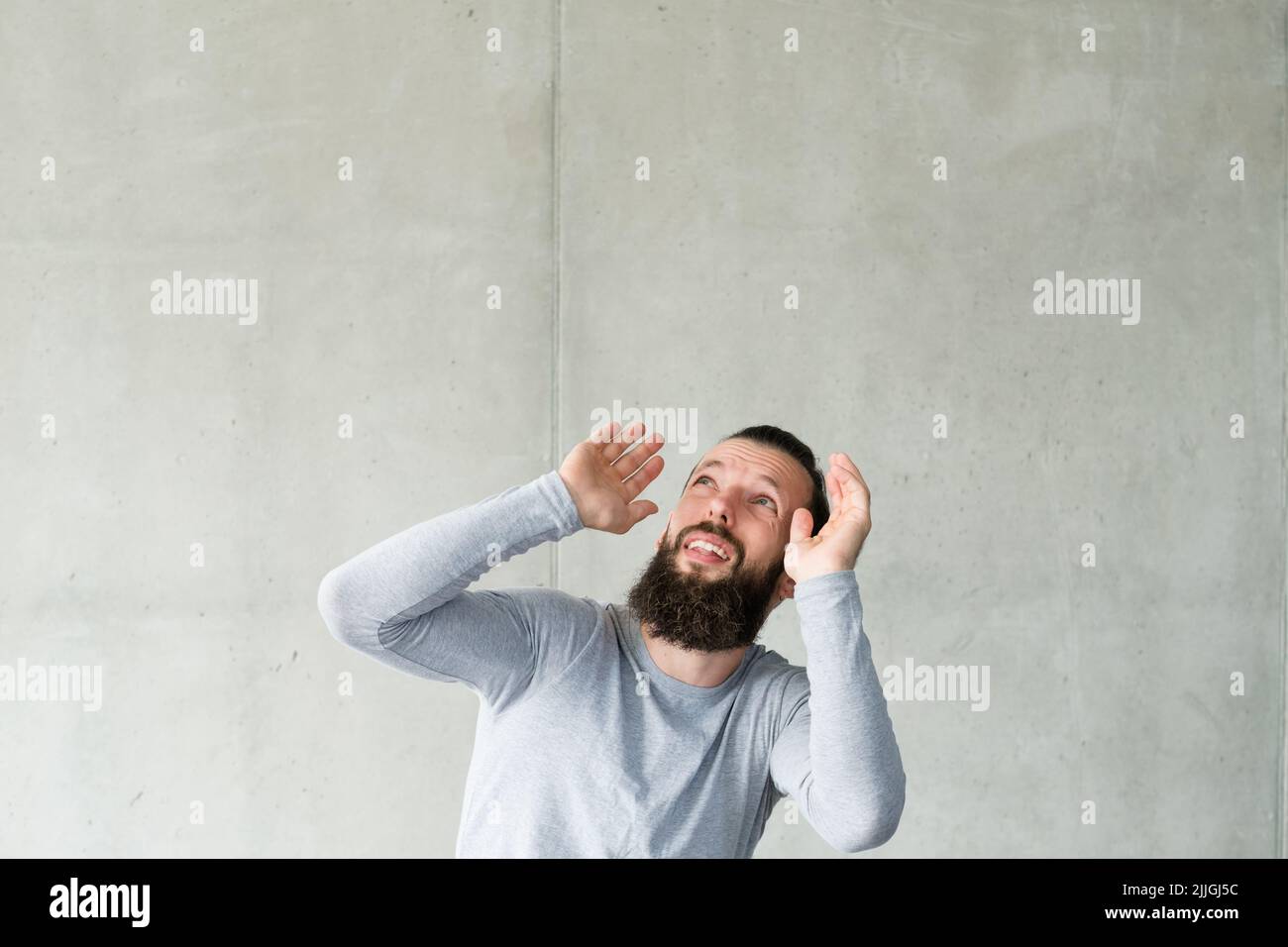 Shocked bearded man hiding face hi-res stock photography and images - Alamy