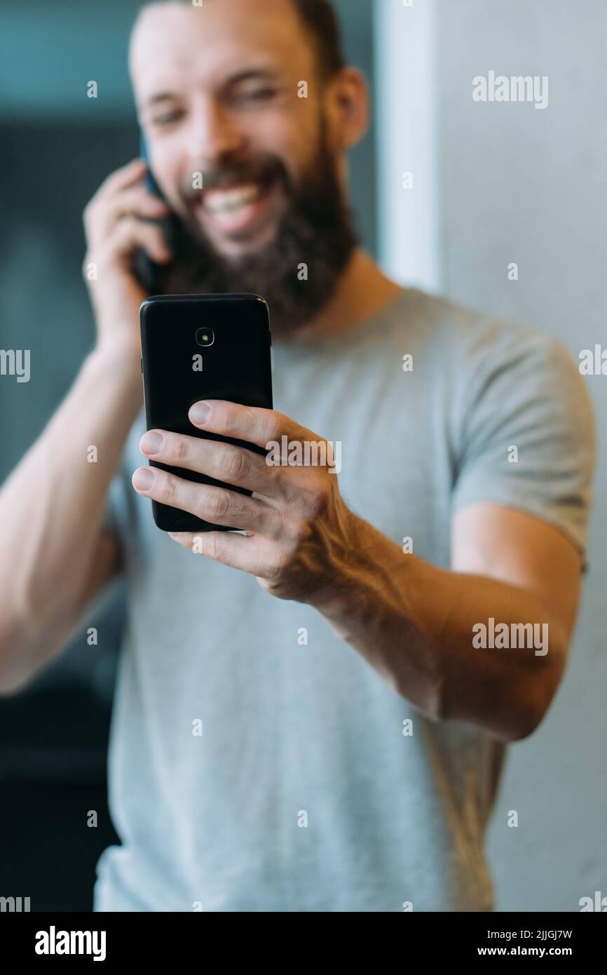 networking obsession guy social media phone Stock Photo - Alamy