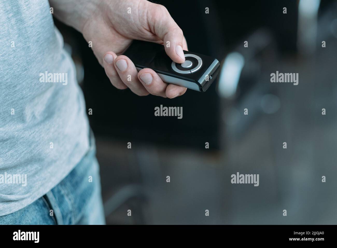 wireless multimedia equipment man remote control Stock Photo - Alamy