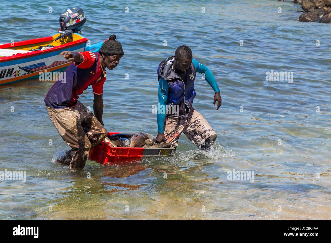 Dakar, Senegal. August 18, 2019: Fishermen with a fishing boat in a ...