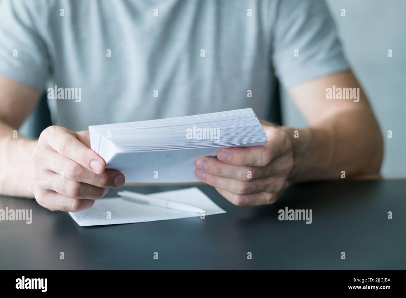 paperwork sending mail man invitation letters Stock Photo - Alamy