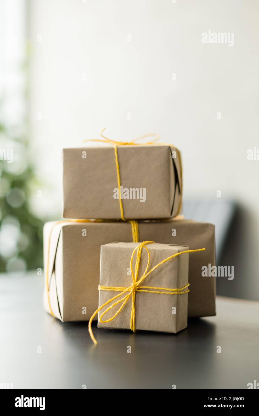 goods delivery service beige gift boxes stack Stock Photo - Alamy