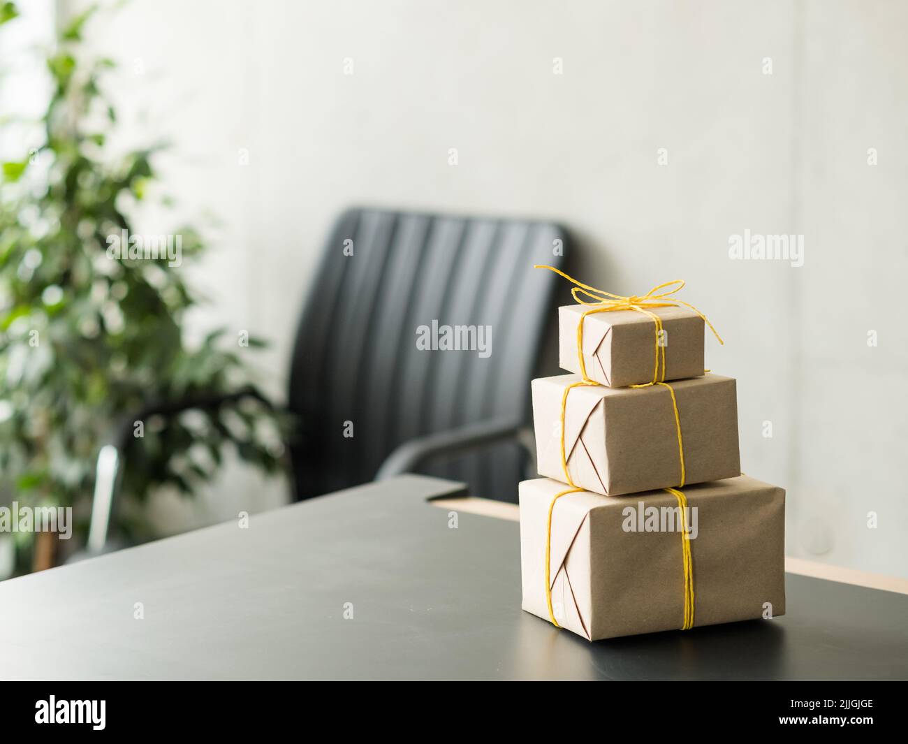 goods delivery service beige gift boxes stack Stock Photo - Alamy