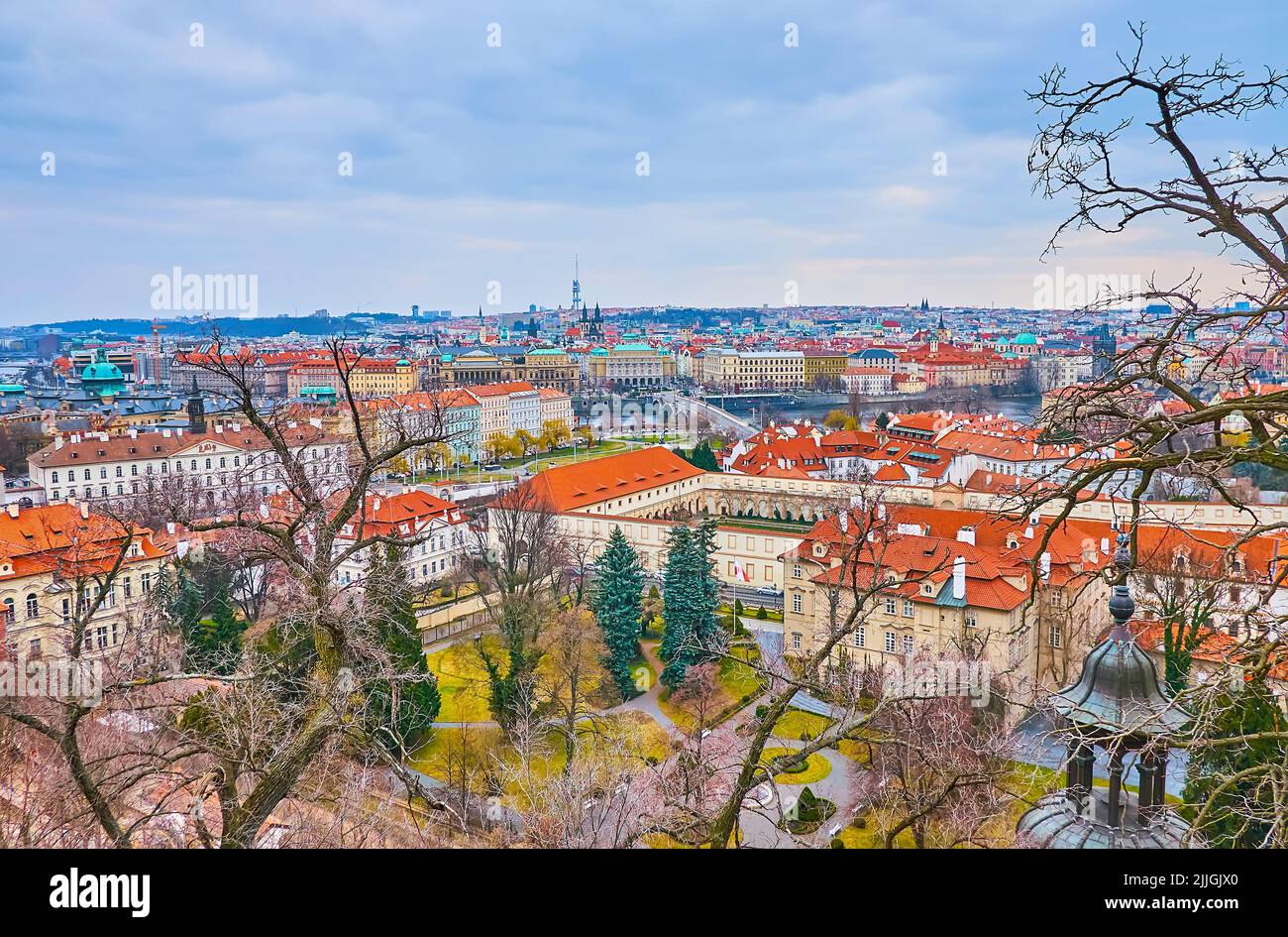 The old Prague aerial cityscape behind the old spread trees of the ...