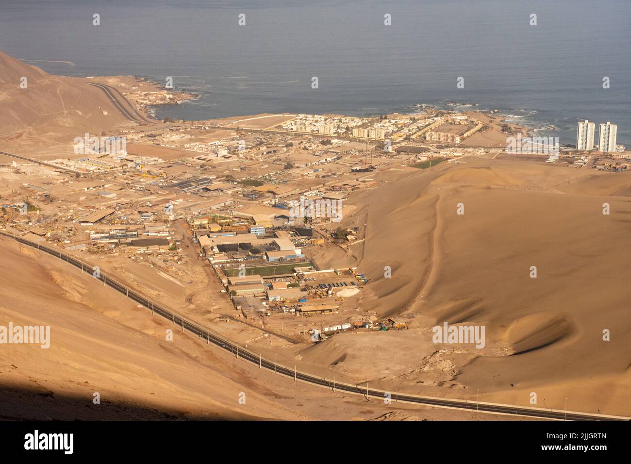 The giant sand dunes of Cerro Dragon with the city of Iquique, Chile ...