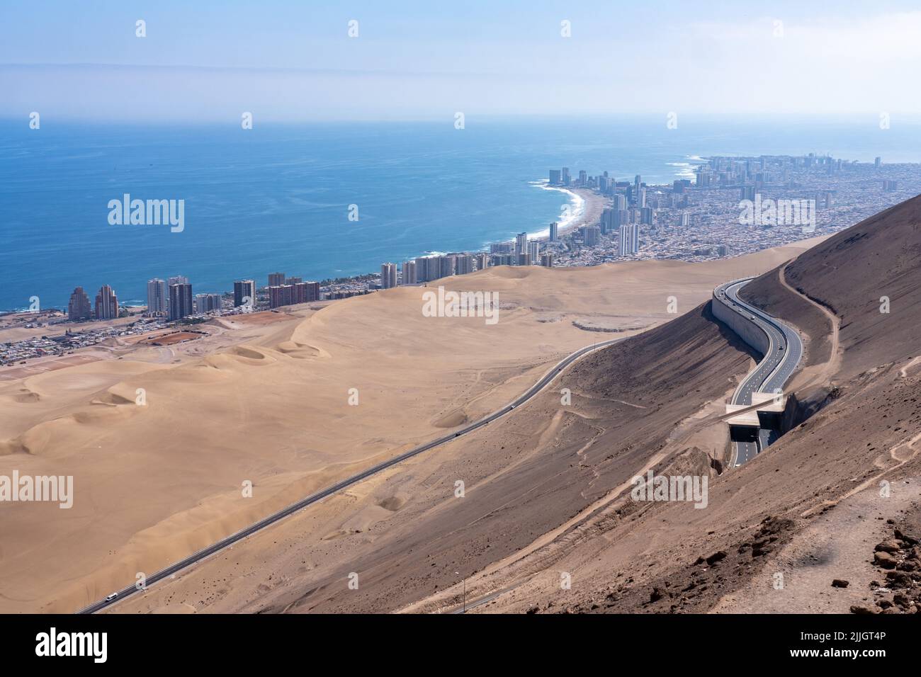 The giant sand dunes of Cerro Dragon with the city of Iquique, Chile ...