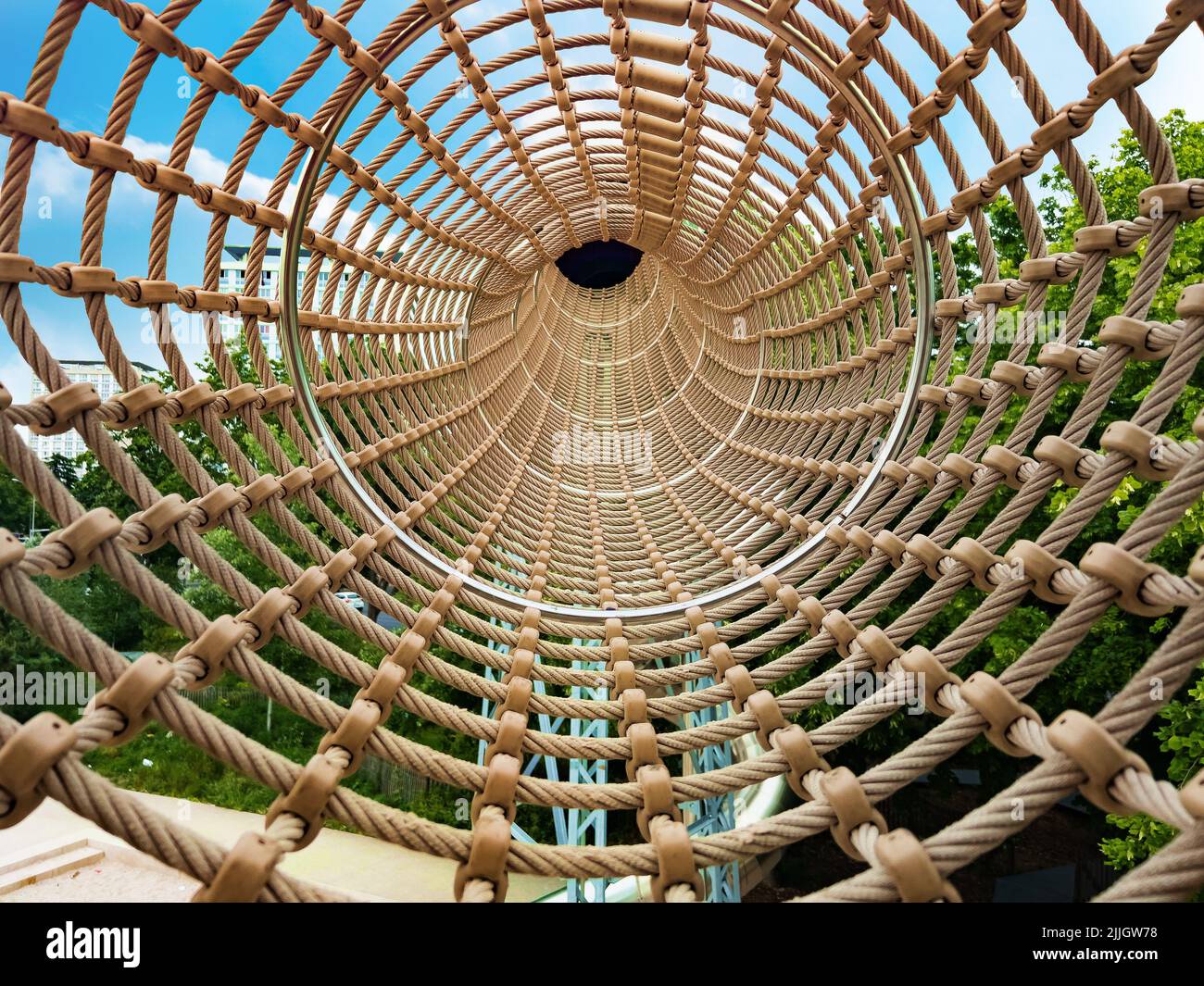 Inside net tunnel on the playground hanging above ground Stock Photo ...