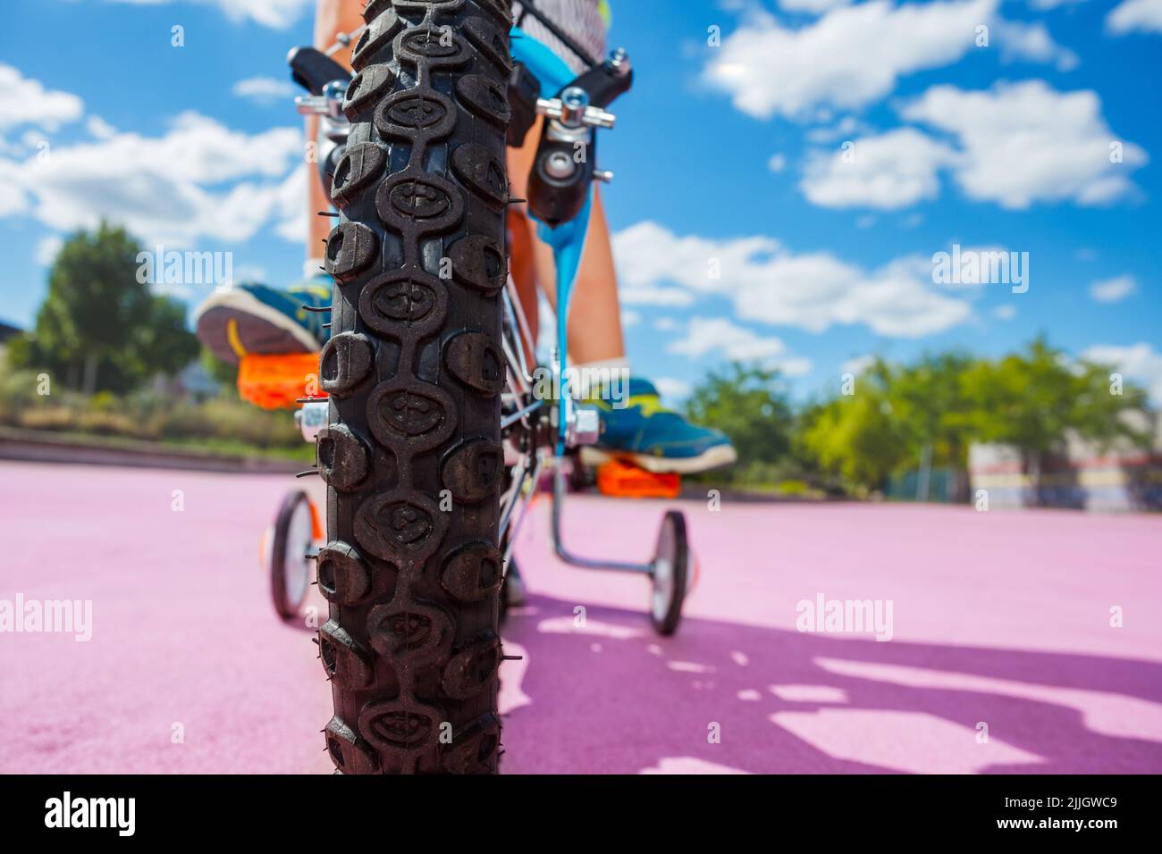 Close-up photo of the little bicycle wheel and boy push pedals Stock ...
