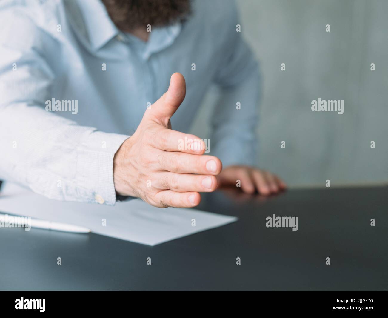 business man outstretching hand greeting job hire Stock Photo - Alamy