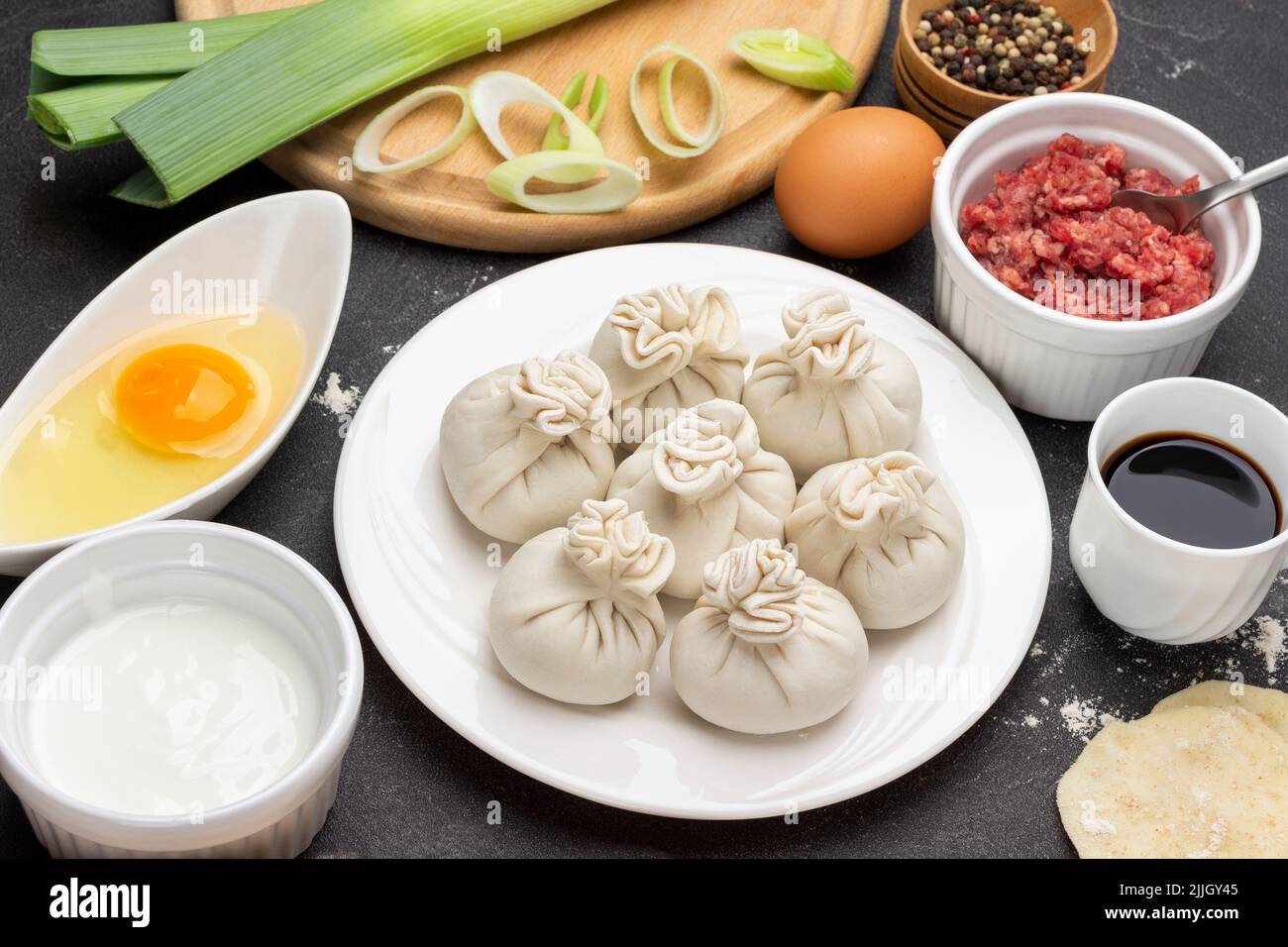 Raw dumplings on plate. Ingredients for making dumplings. Meat filling ...