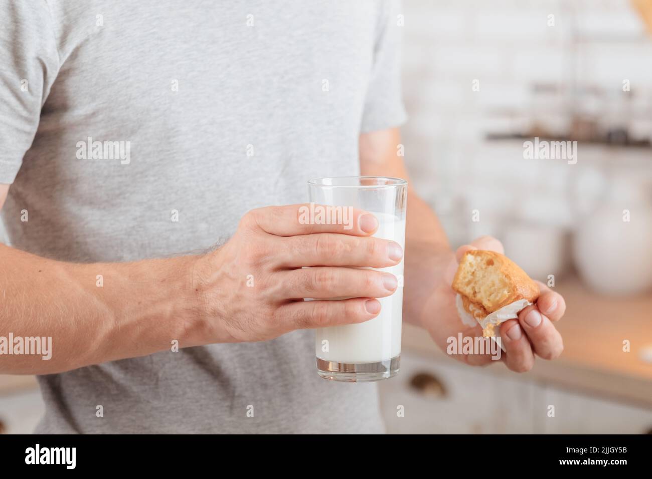 sport nutrition man eating soy milk muffin Stock Photo - Alamy