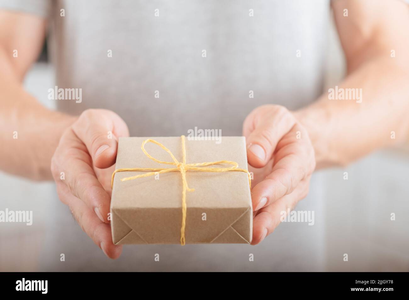 special day delivery service man hands gift box Stock Photo - Alamy