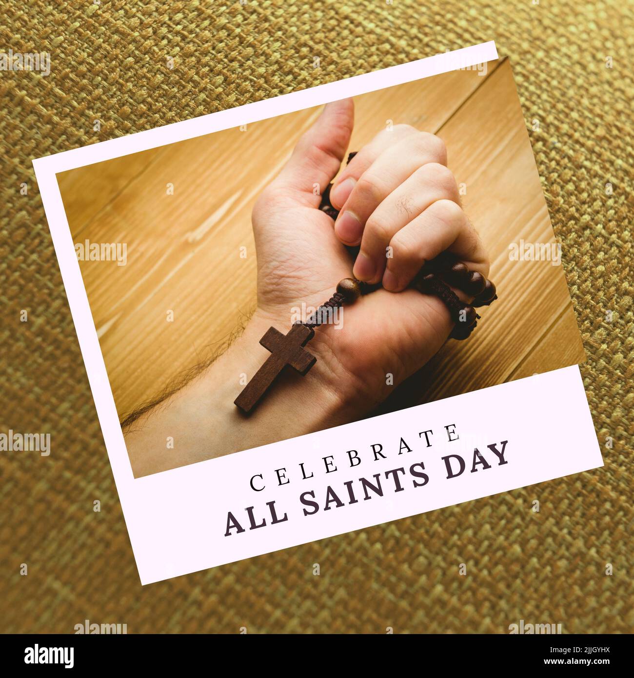 Composition of celebrate all saints day text with hand holding rosary ...