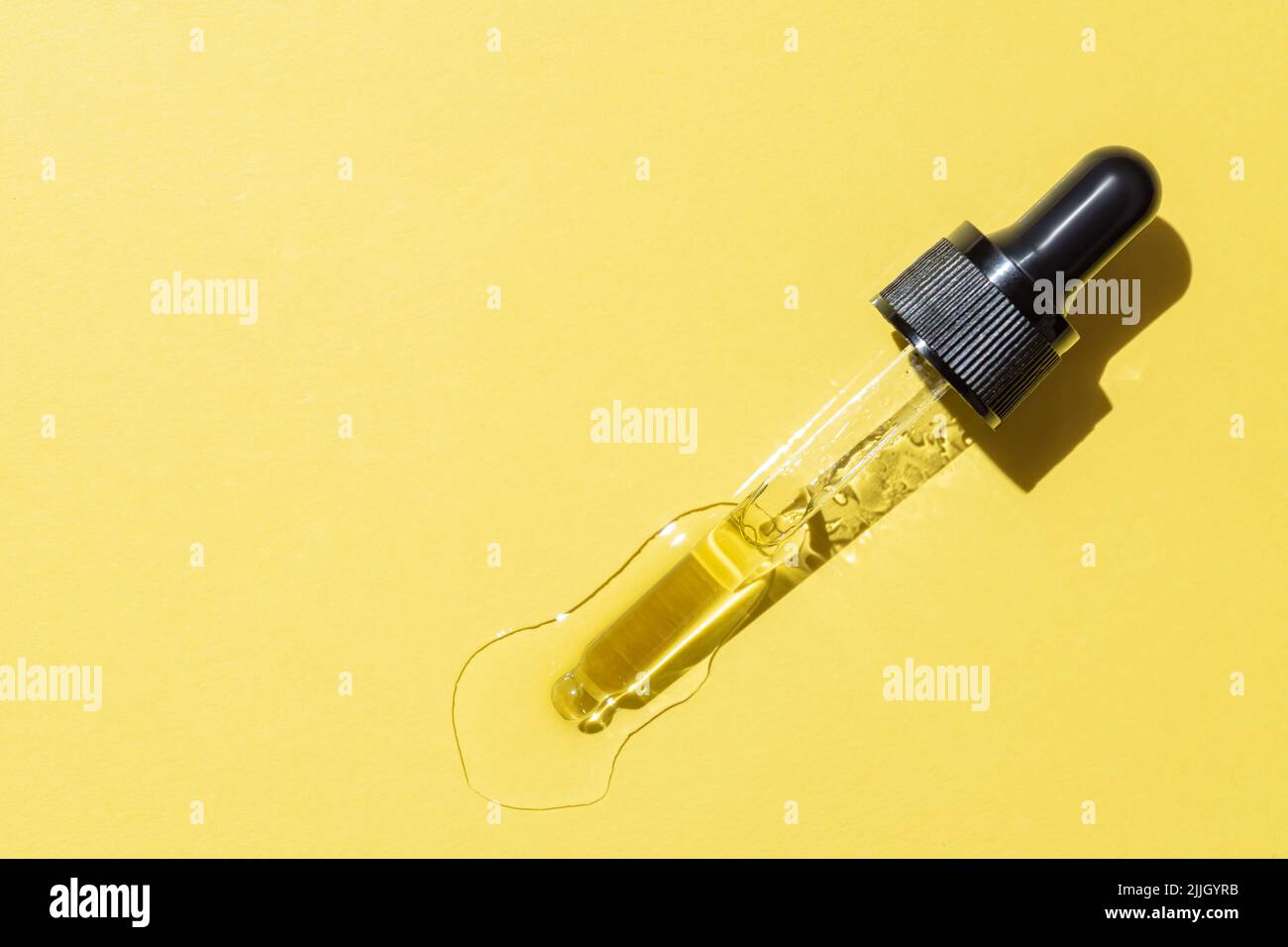 Bottle pipette dropper with liquid yellow retinol or vitamin c gel or ...