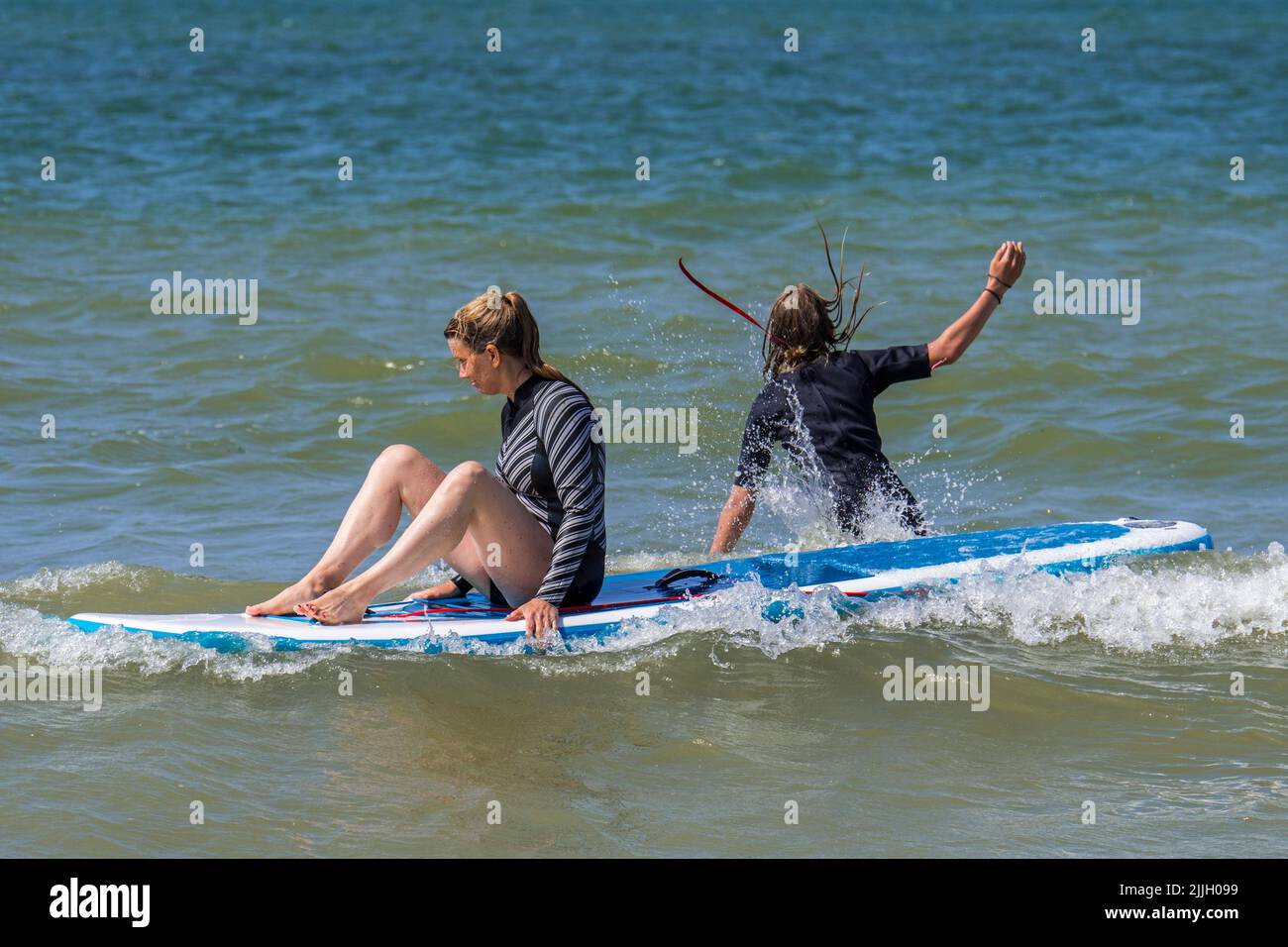 Two girls on paddle hi-res stock photography and images - Alamy