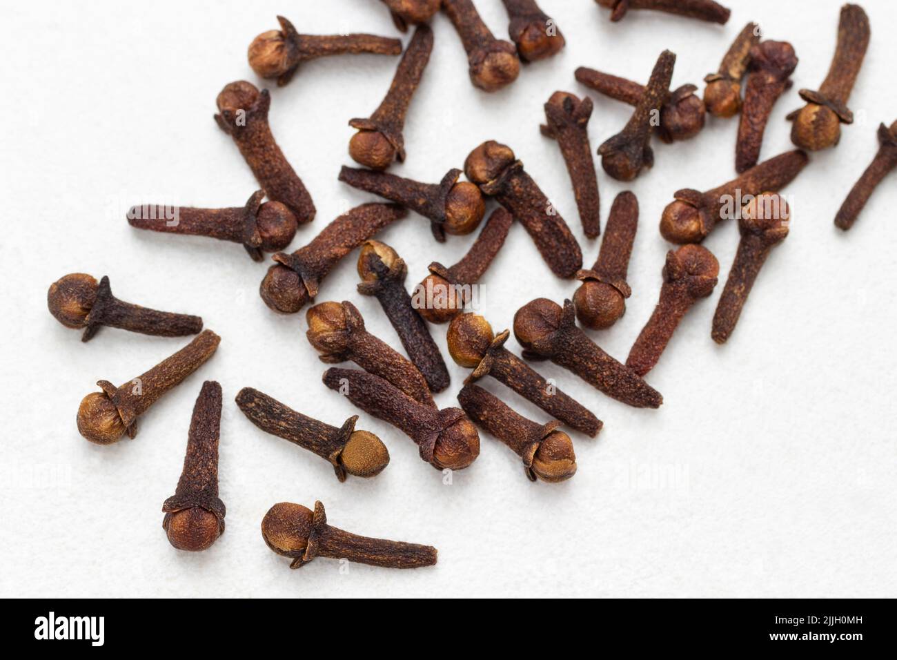 Cloves - dry spices. Close up. Flat lay. White background Stock Photo ...