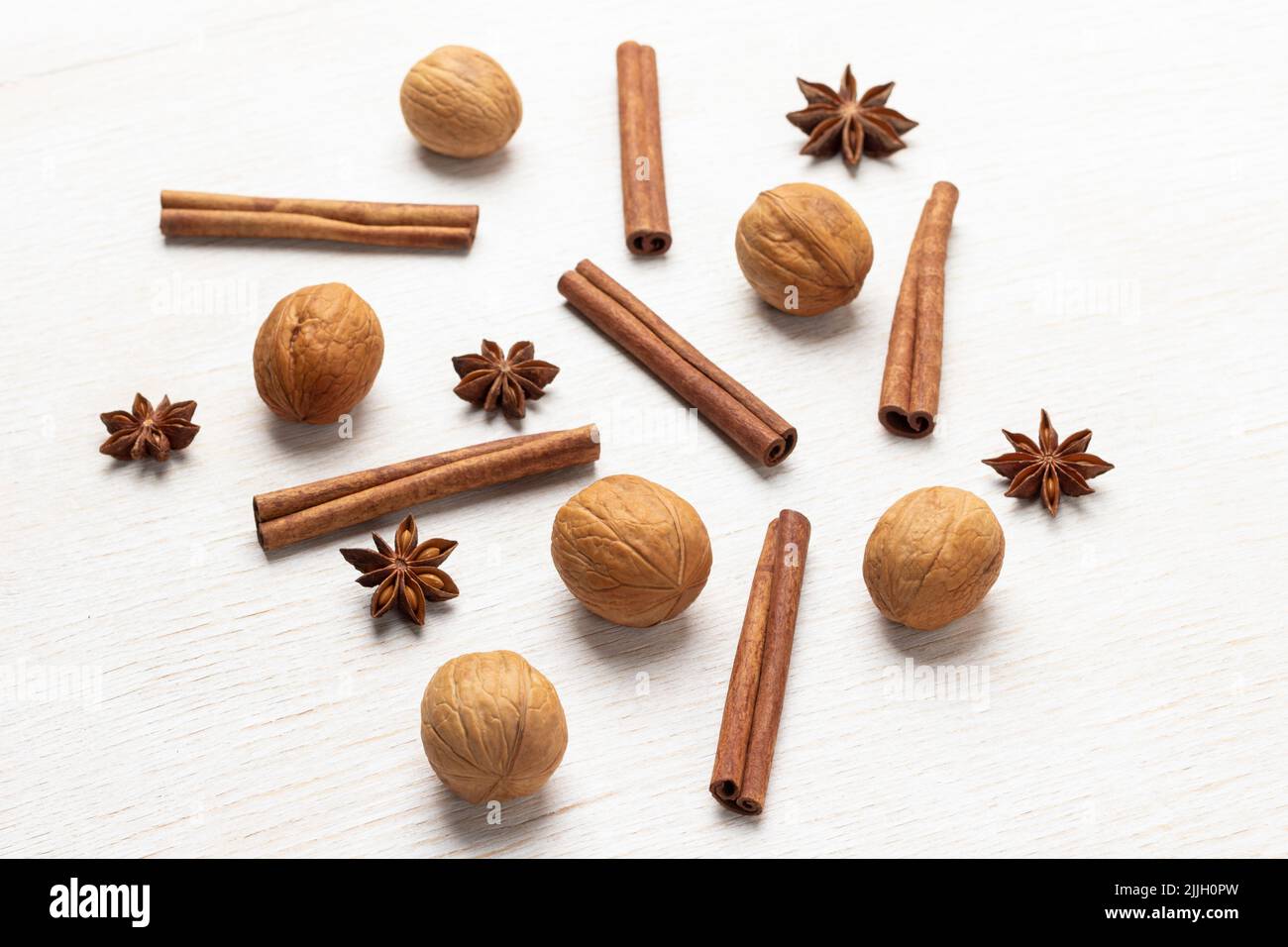 Walnut, cinnamon sticks and star anise. Top view. White background ...