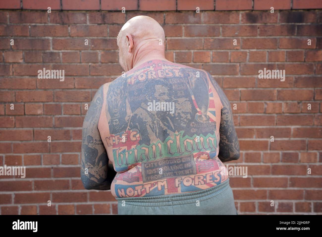 A Nottingham Forest fan with tattoos poses for a picture before a pre ...