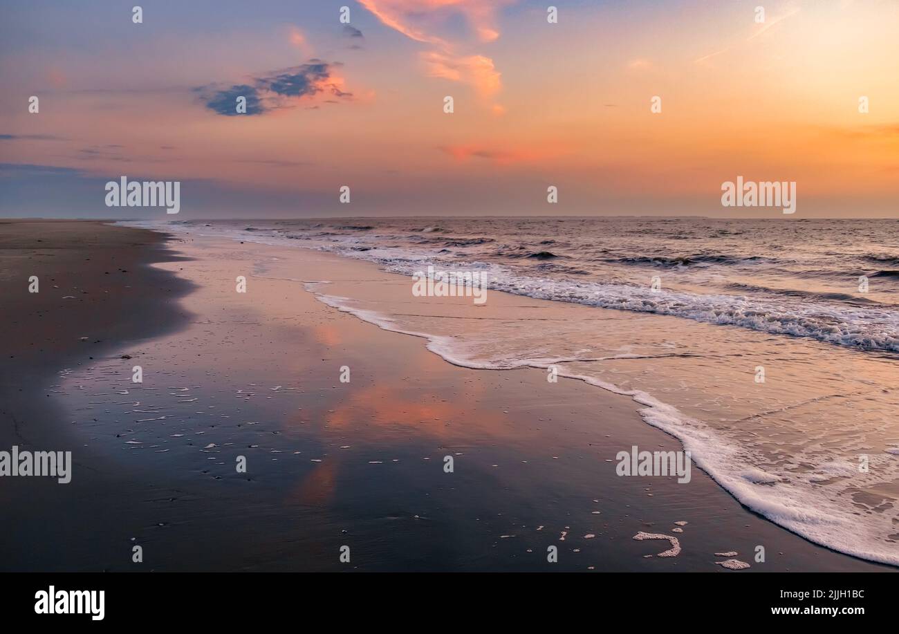 colorful sunset on the beach, North Sea, mud flat Stock Photo - Alamy