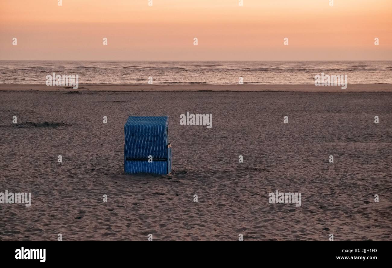 colorful sunset on the beach, mud flat, beach chair on sunset Stock ...