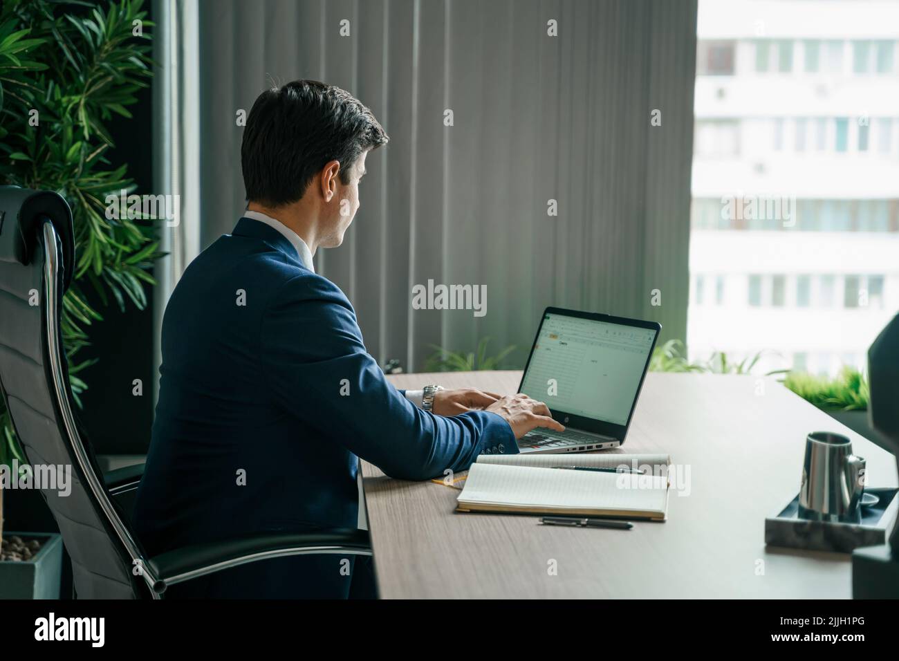 Businessman working with laptop in modern office. General manager,ceo ...