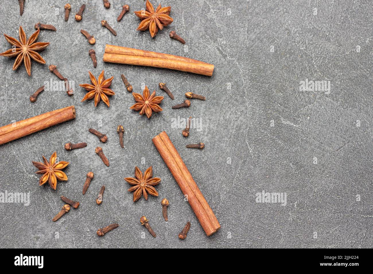 Spices: cinnamon sticks, star anise and cloves. Copy space. Flat lay ...