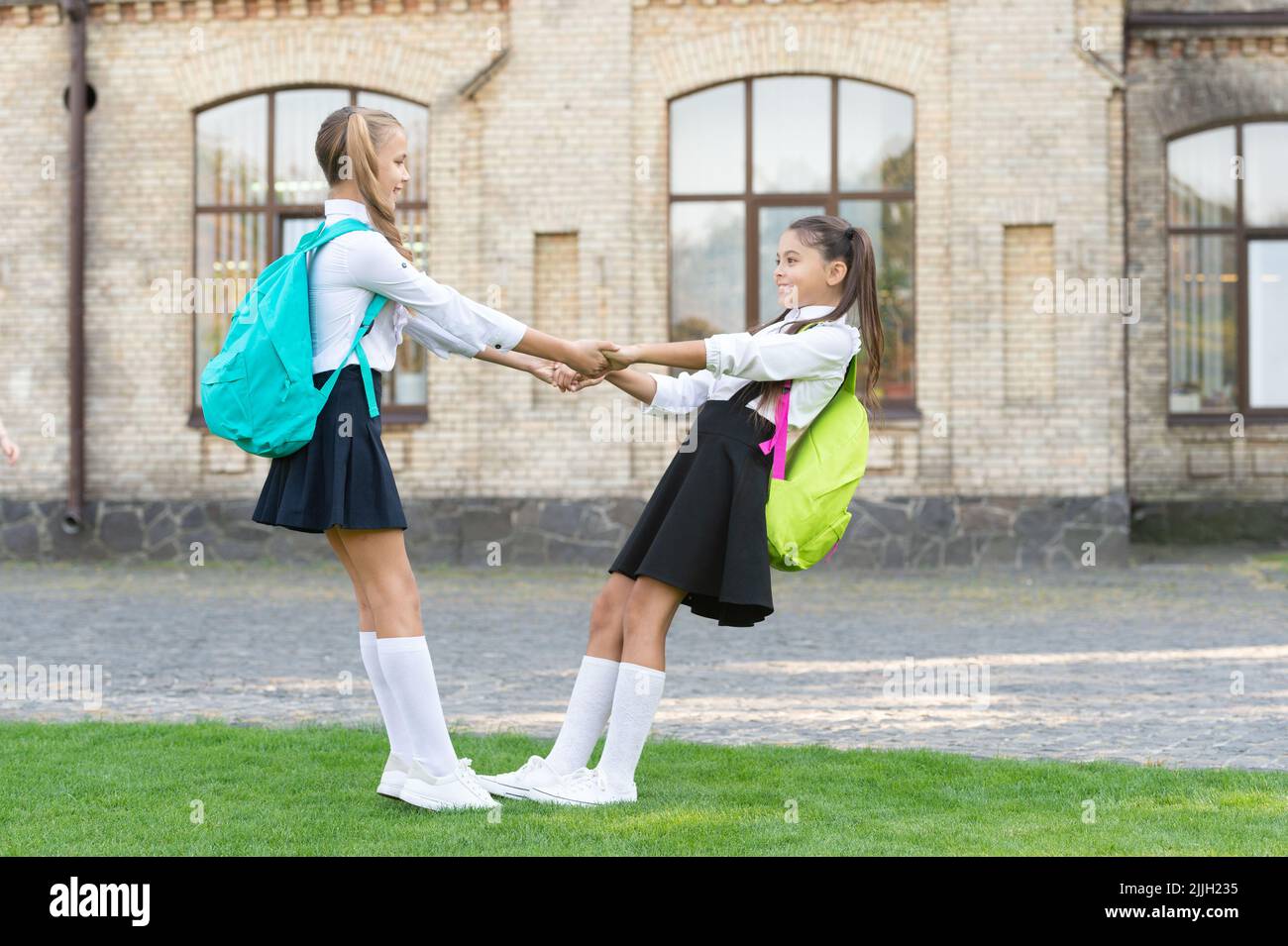 two school girls friends having fun together outdoor Stock Photo - Alamy