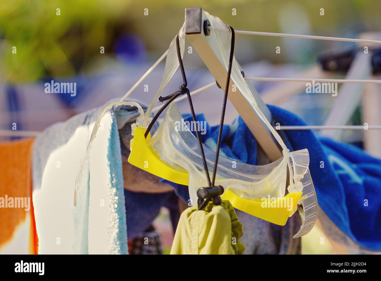 details of bathing equipment on a washing line Stock Photo - Alamy
