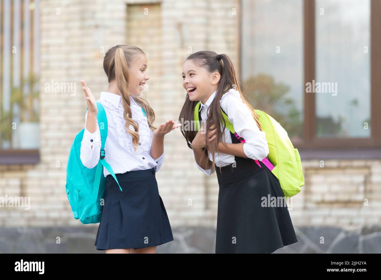 two school girls friends joke together outdoor Stock Photo - Alamy