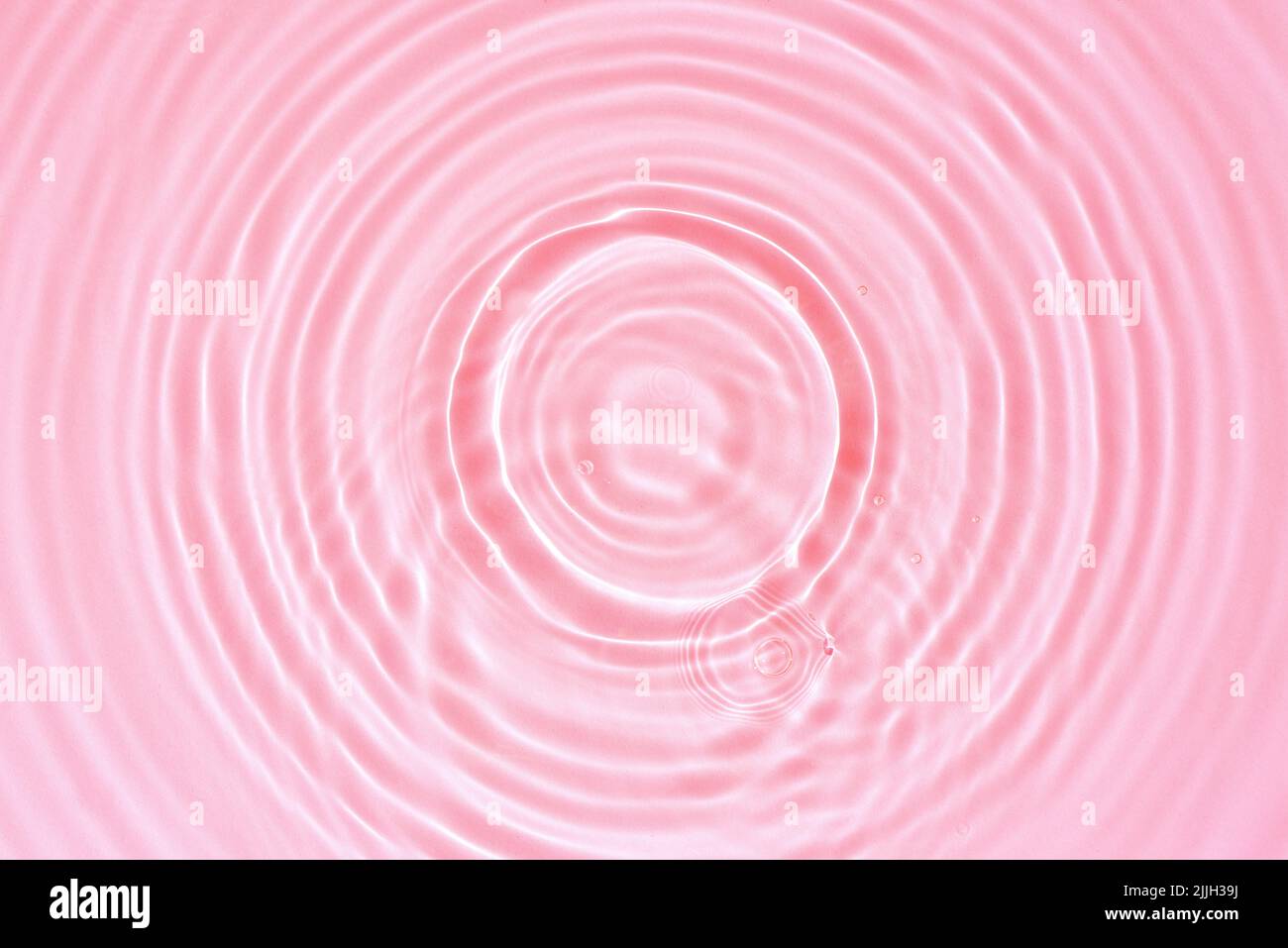 Abstract cosmetic background, pink water texture with round ripples ...