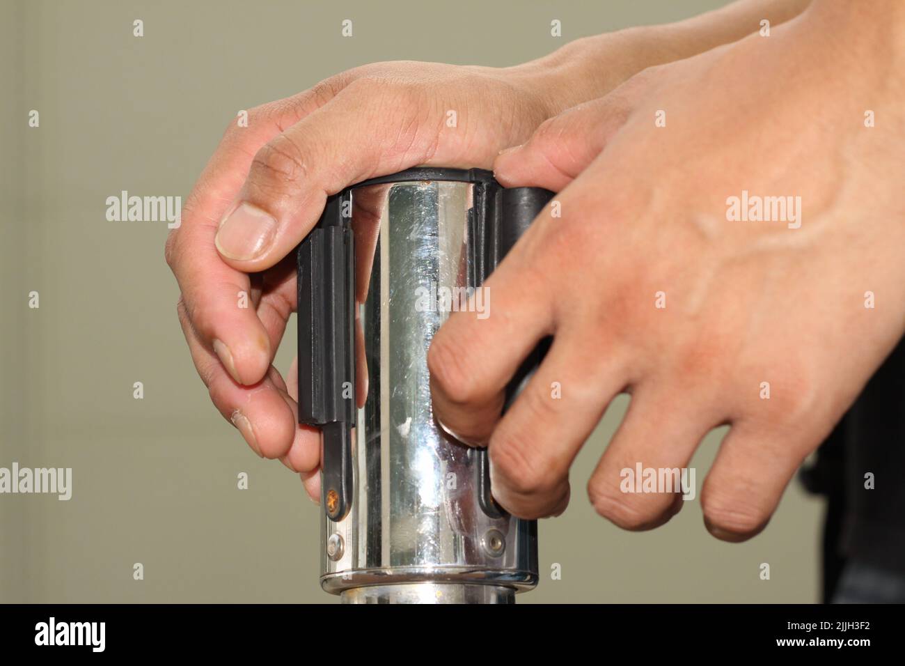 A close-up shot of holding tight to the iron equipment Stock Photo - Alamy