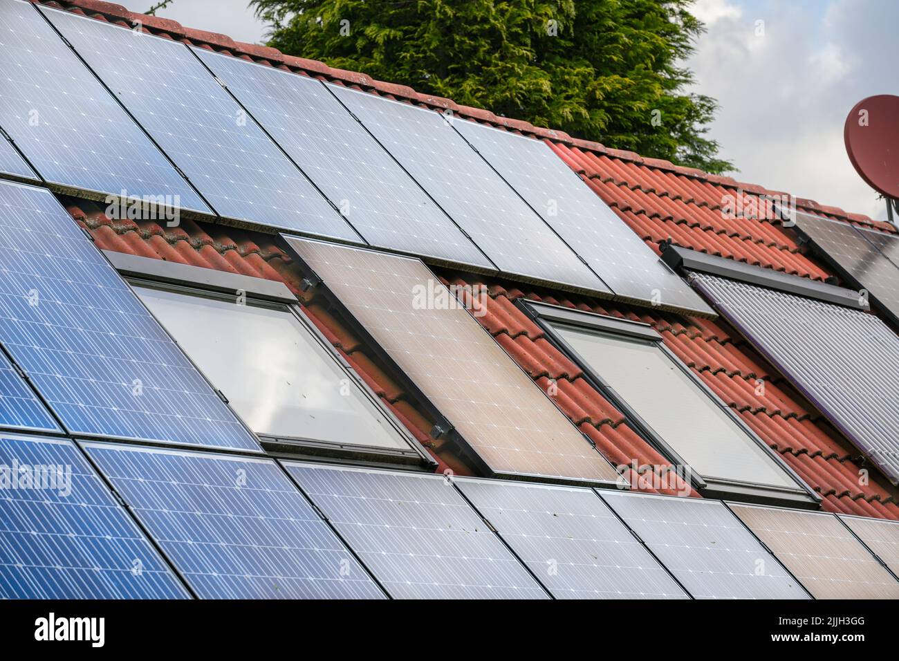 A close-up shot of solar system panels on a rooftop Stock Photo - Alamy