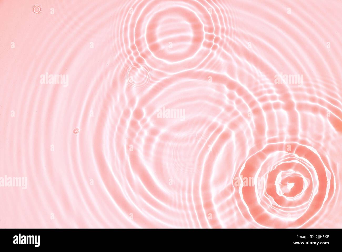 Pink water texture, cosmetic background pink water surface with rings ...