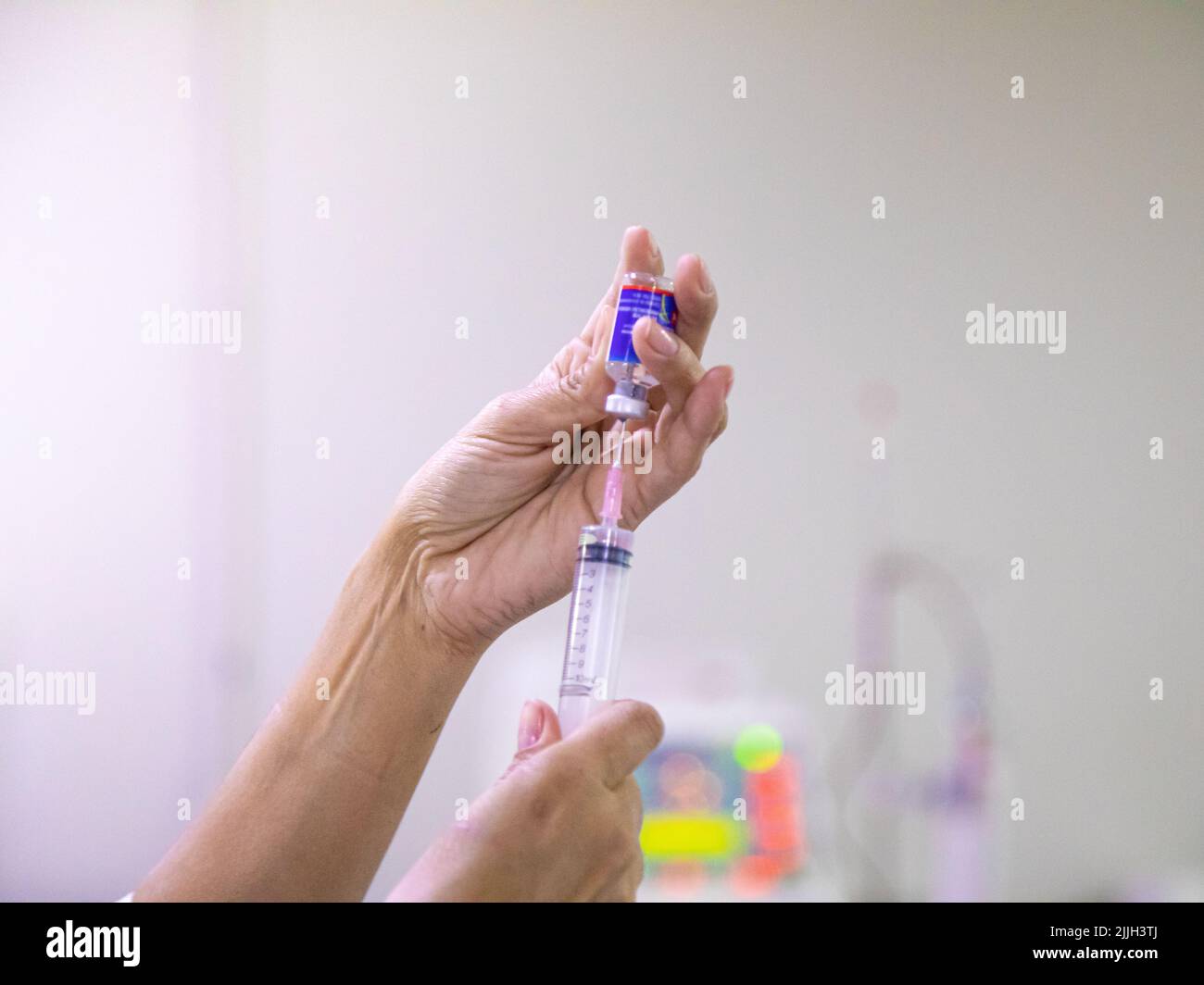 hands preparing injection for vaccine or treatments with dialysis ...