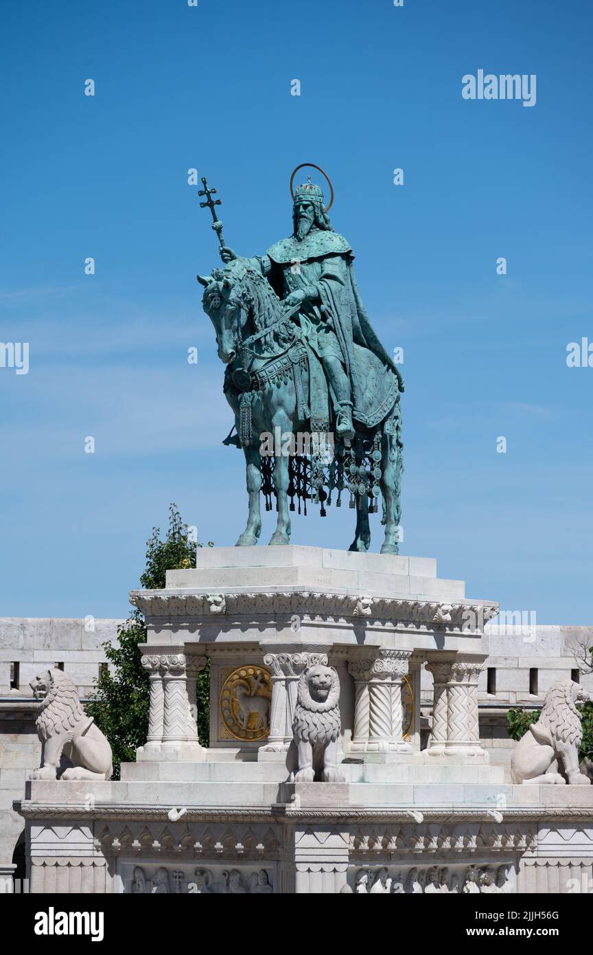 The vertical view of the St. Stephen statue with the blue sky in the ...