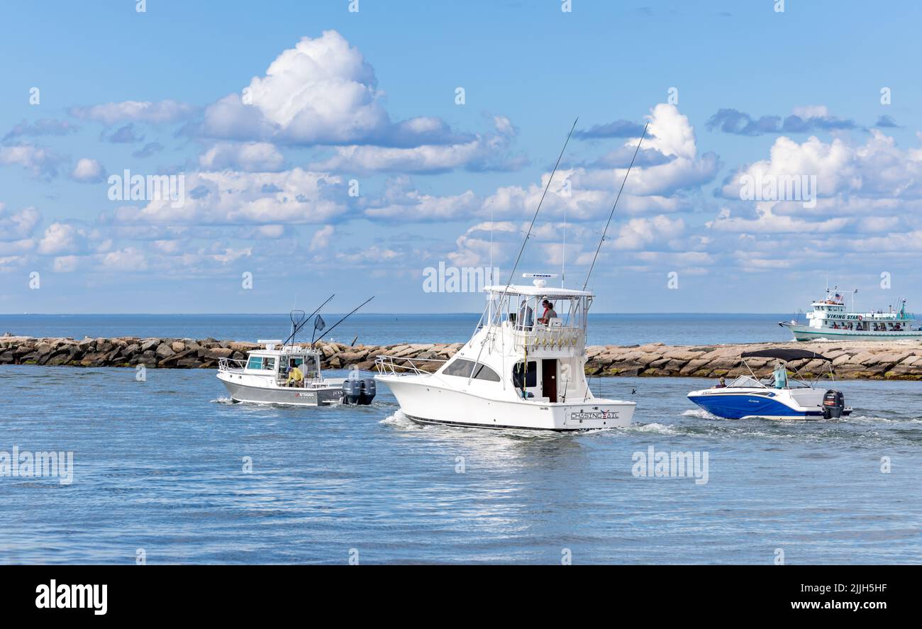 Boats leaving Montauk Harbor Stock Photo - Alamy