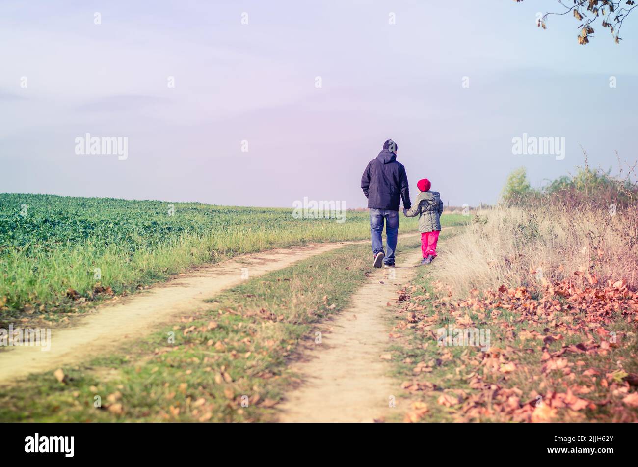 father and daughter having happy time together while walking in ...