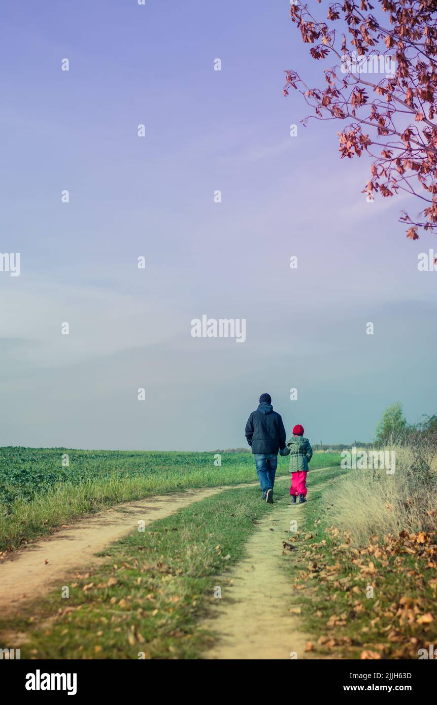 father and daughter having happy time together while walking in ...