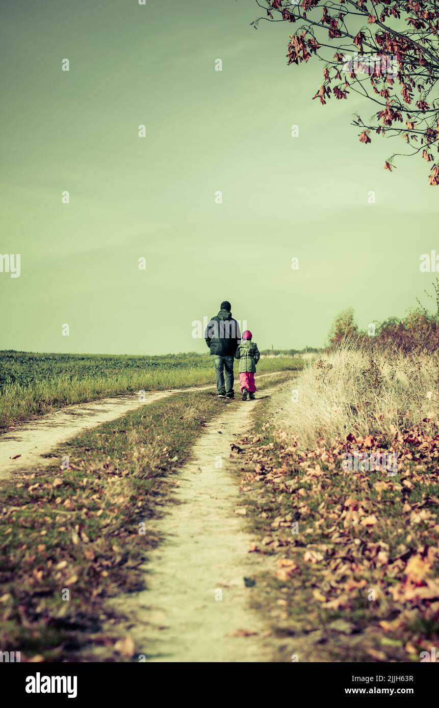 father and daughter having happy time together while walking in ...