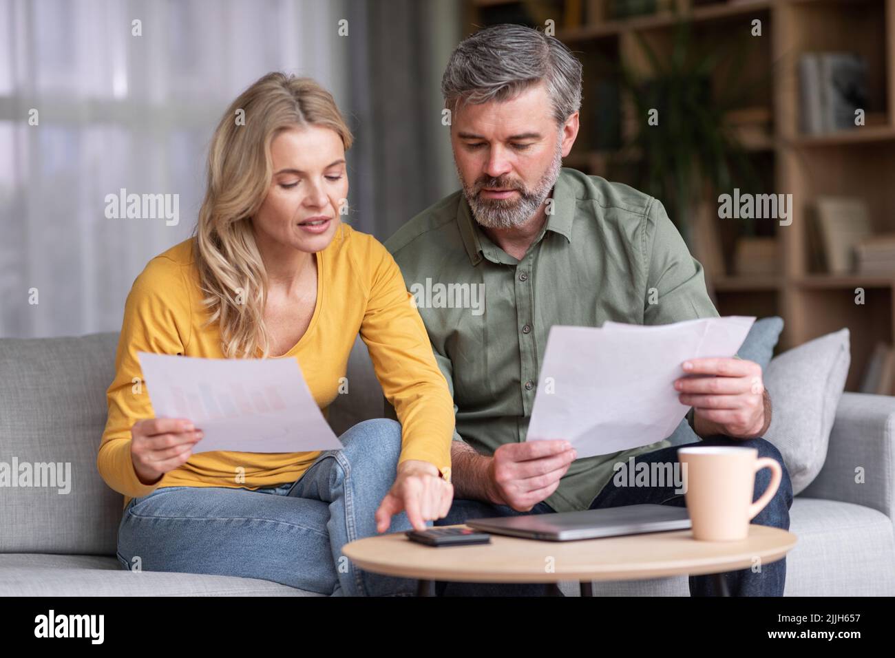 Financial Literacy. Busy Middle Aged Husband And Wife Calculating ...