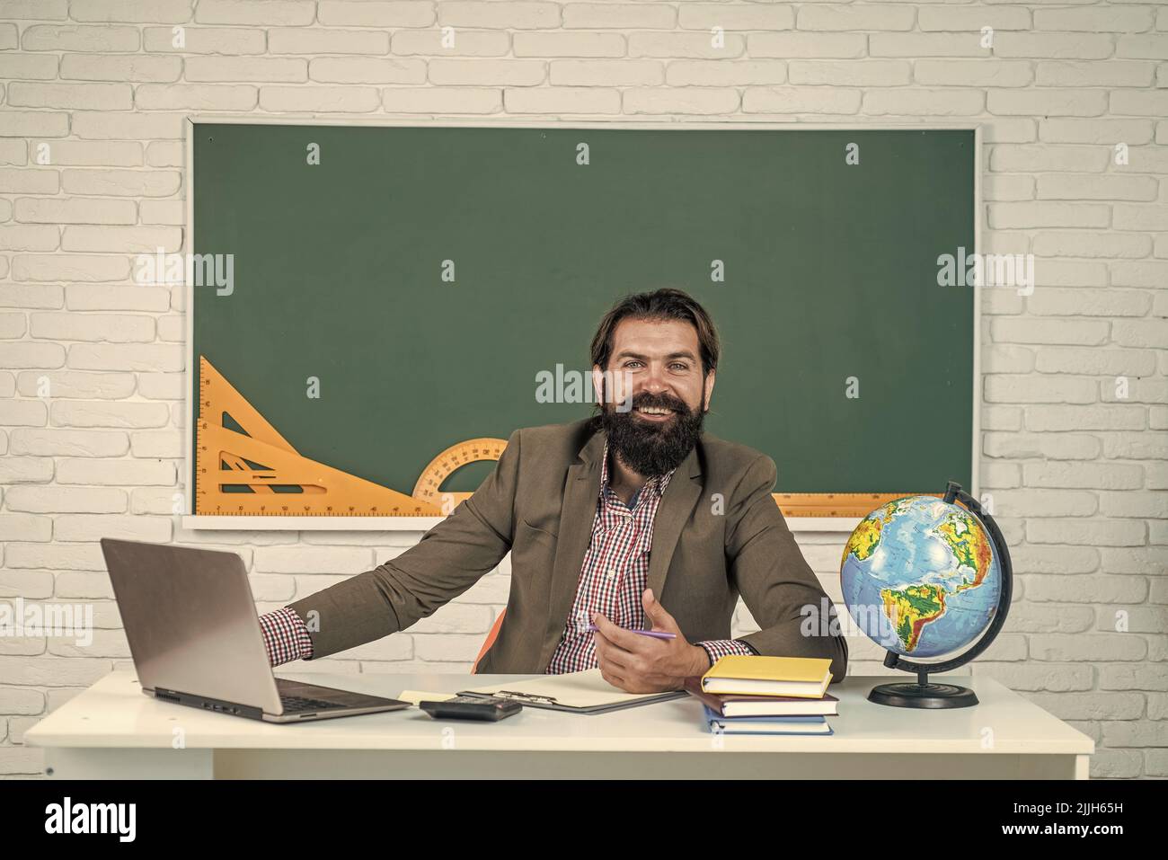 brutal unshaven guy university lecturer in classroom, teachers day ...