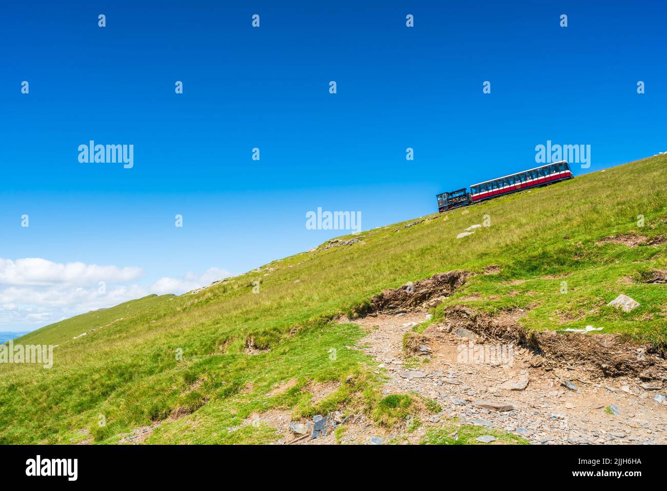 SNOWDON, WALES - JULY 09, 2022: Mountain railway train takes tourists ...