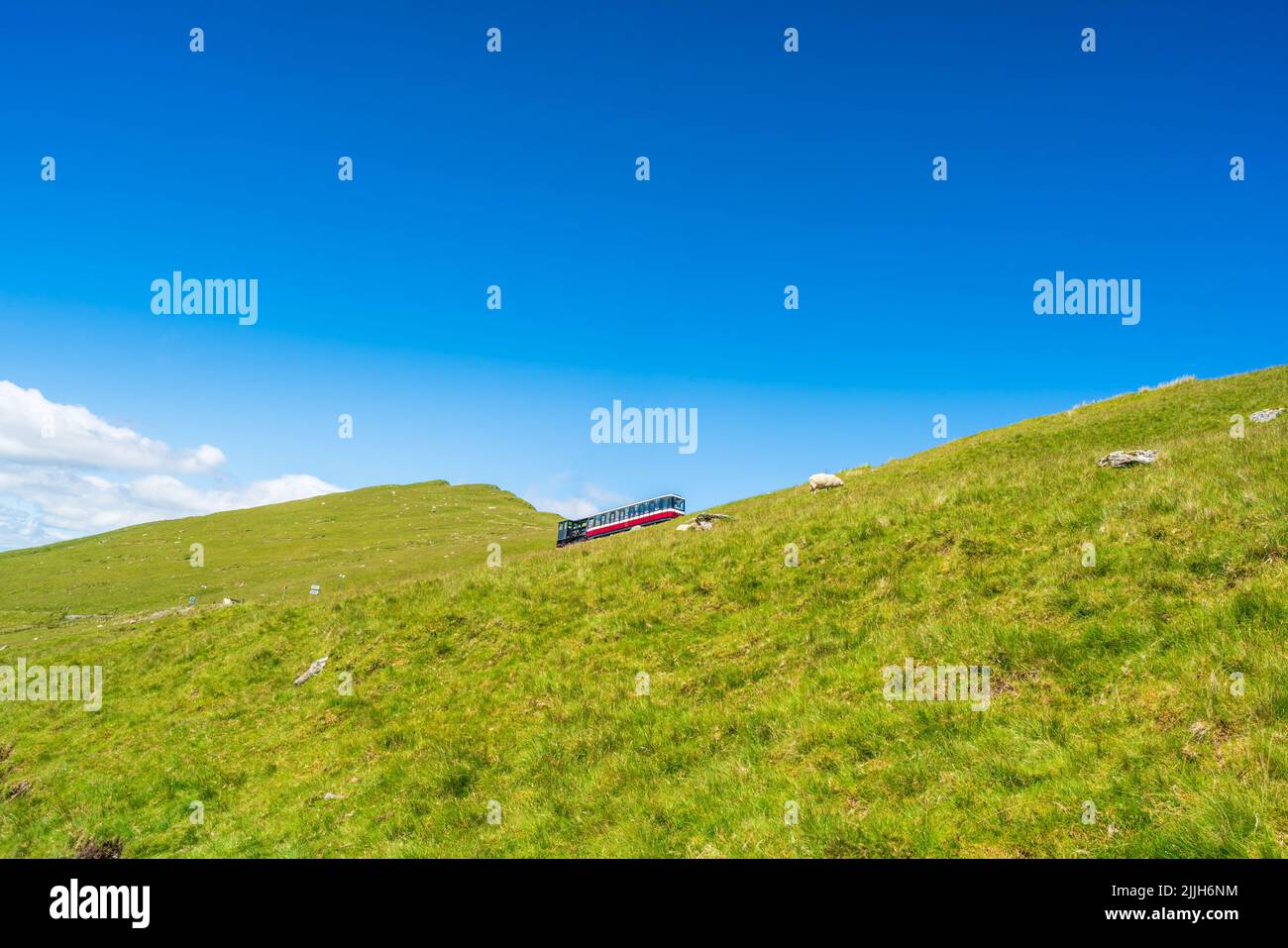 Mountain railway train on Mount Snowdon on a bright sunny day, Wales ...