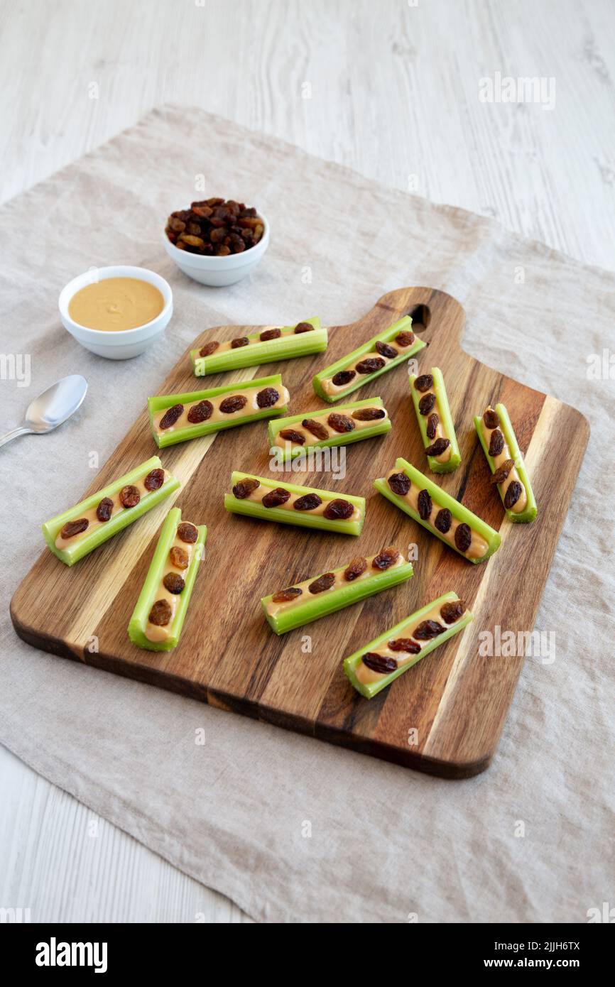 Homemade ants on a log with celery, peanut butter and raisins on a ...