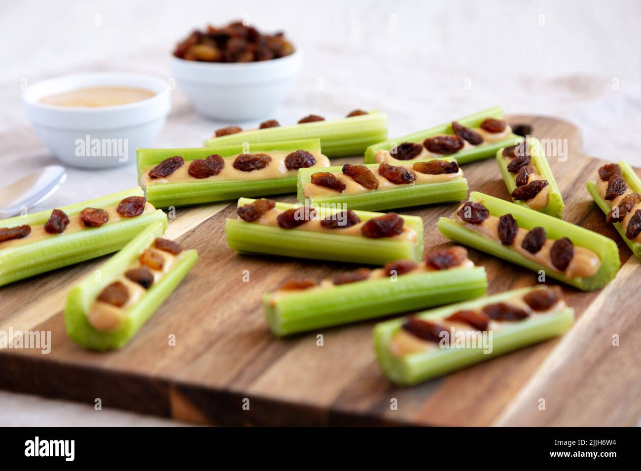 Homemade ants on a log with celery, peanut butter and raisins on a ...