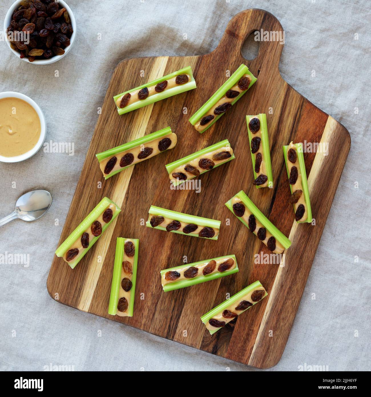 Homemade ants on a log with celery, peanut butter and raisins on a ...
