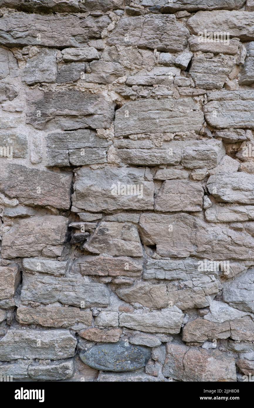 Massive stone wall background. Old castle rock wall Stock Photo - Alamy