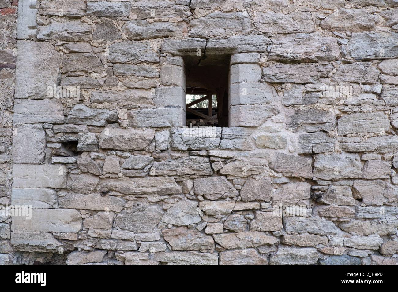 Massive stone wall background. Old castle rock wall Stock Photo - Alamy