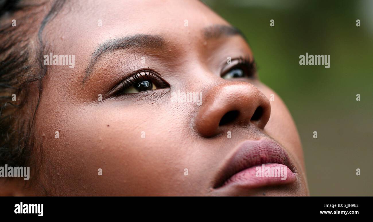 African woman face closing and opening eyes in contemplation Stock ...